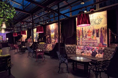 Who knew? Women prefer drinking amidst phallic symbols, stilettos and pills