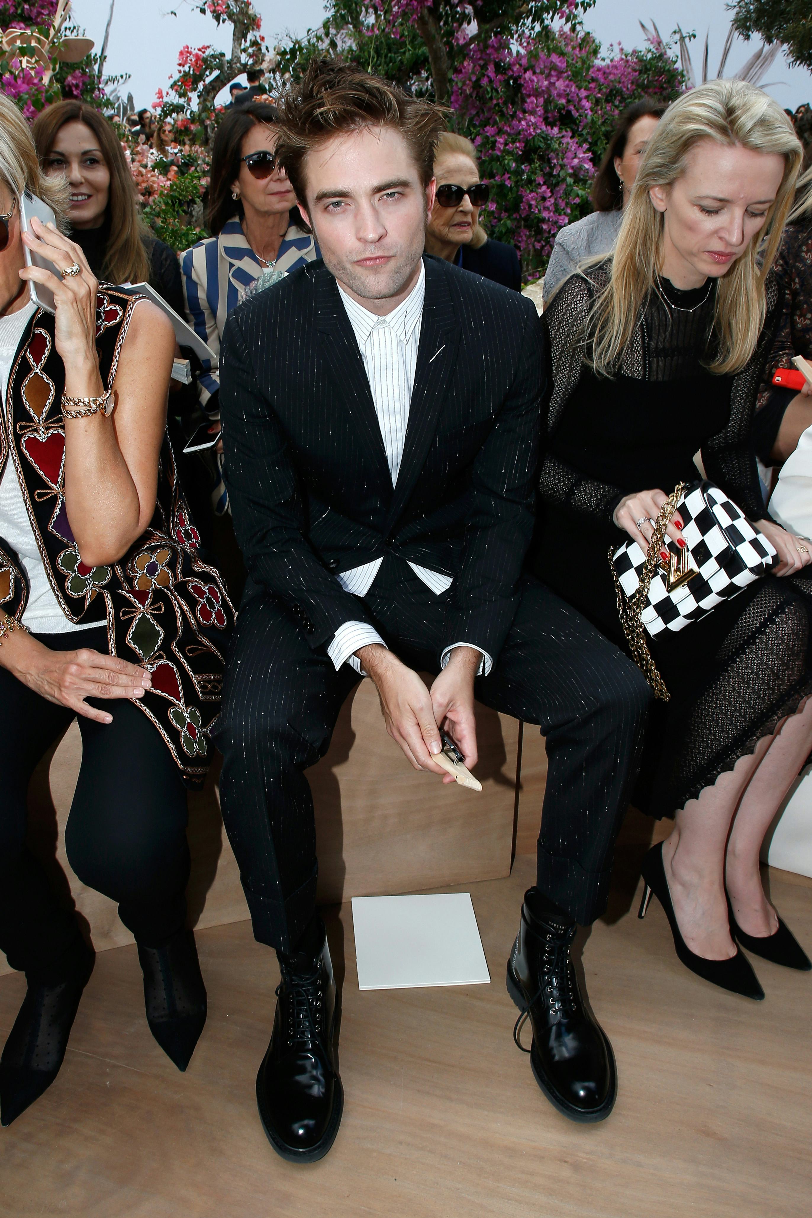 A Visual History of Male Celebrities Enjoying Fashion Shows, From ...