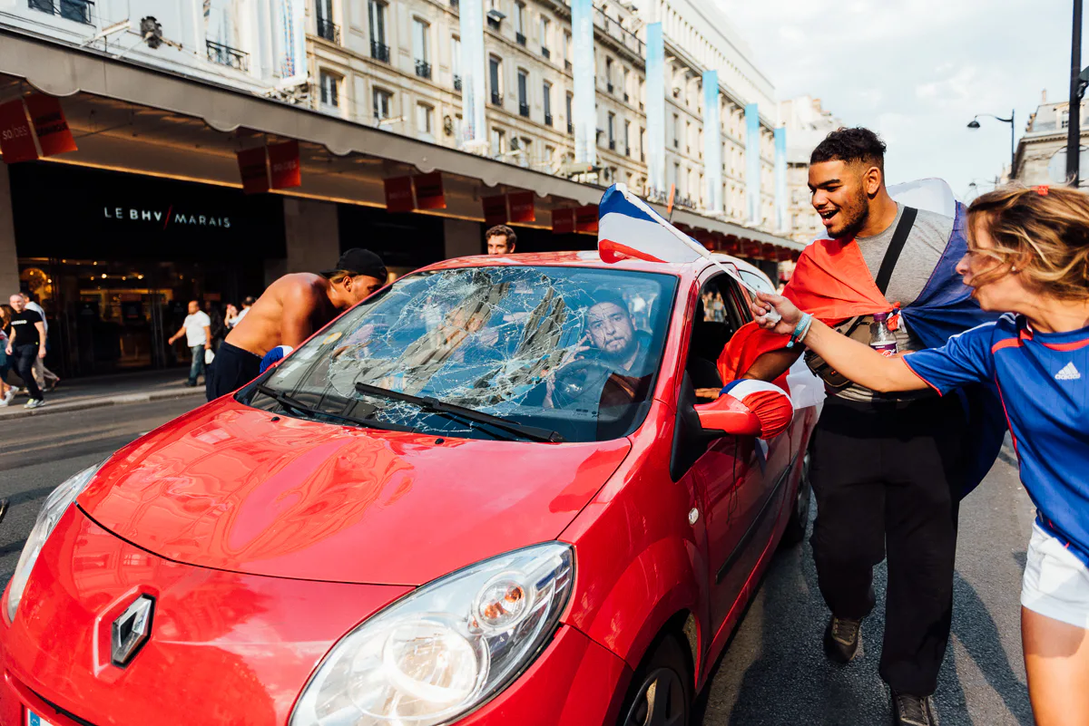 Jubilant Photos of the Wild Celebrations on the Streets of Paris After ...