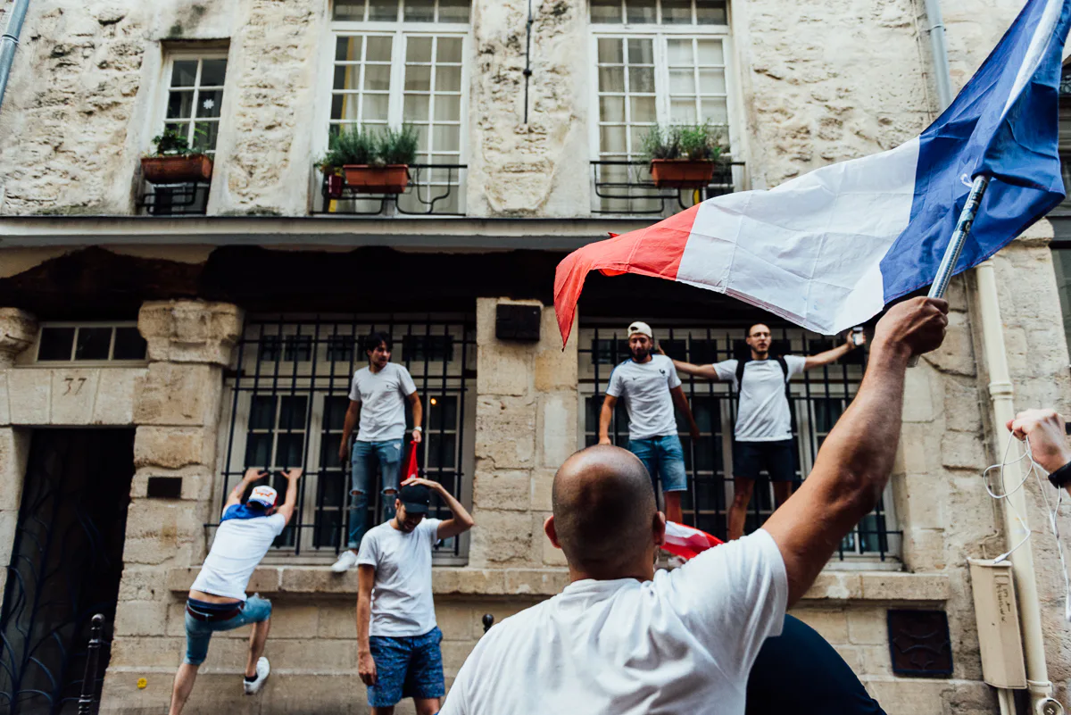 Jubilant Photos of the Wild Celebrations on the Streets of Paris After ...