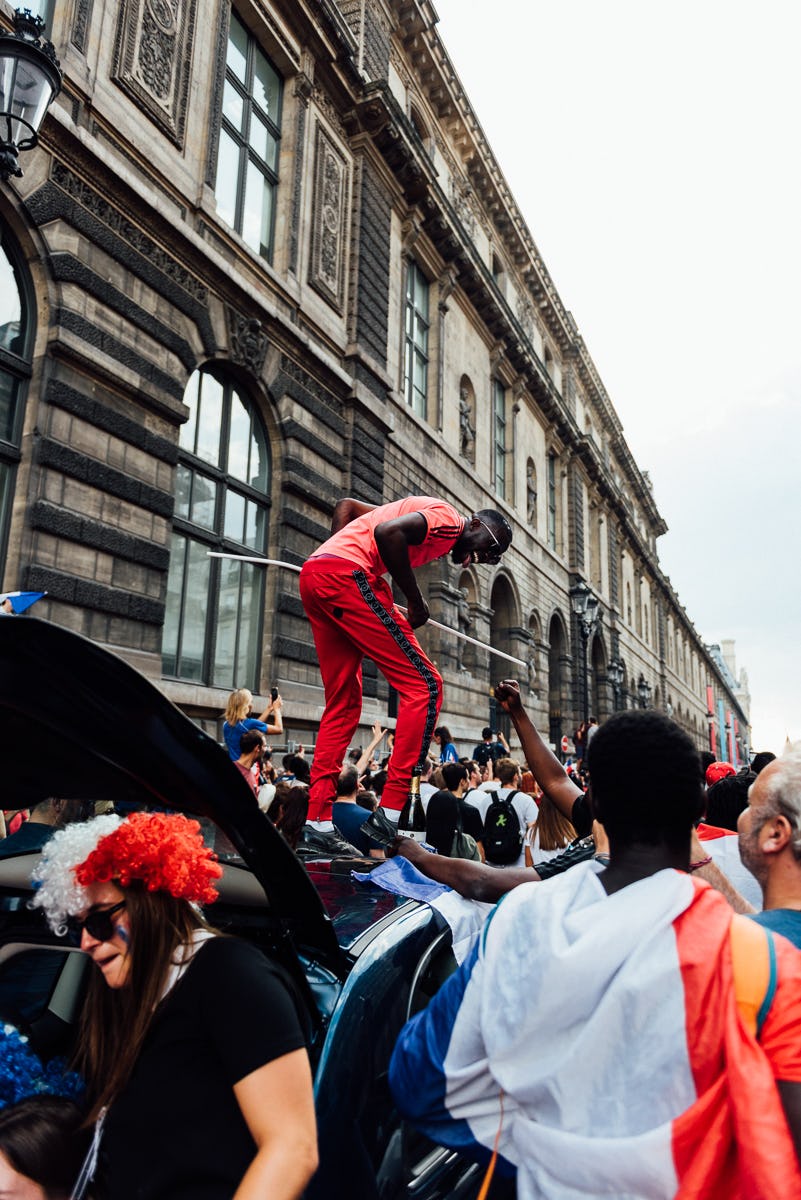 Jubilant Photos of the Wild Celebrations on the Streets of Paris After ...