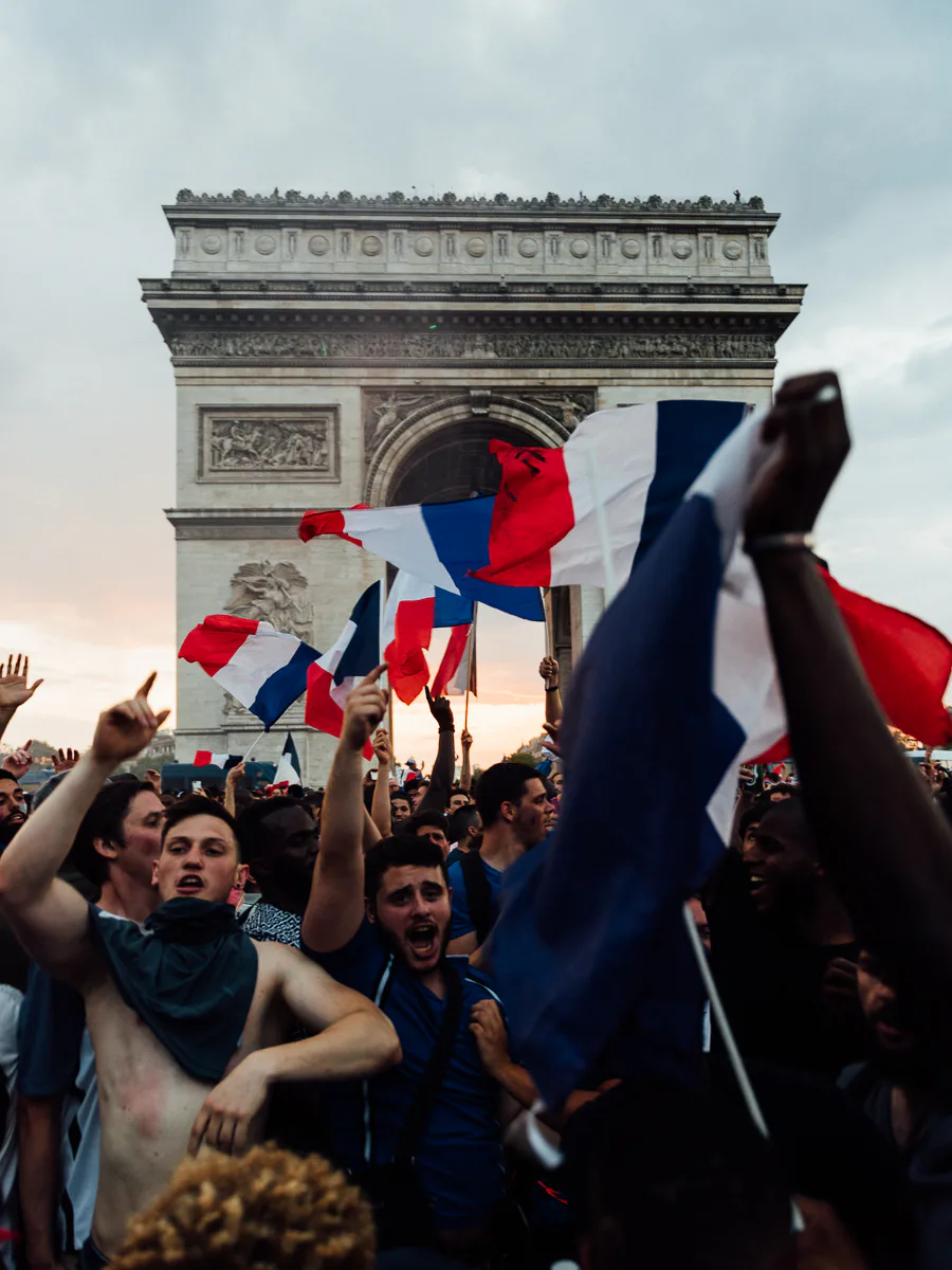 Jubilant Photos of the Wild Celebrations on the Streets of Paris After ...