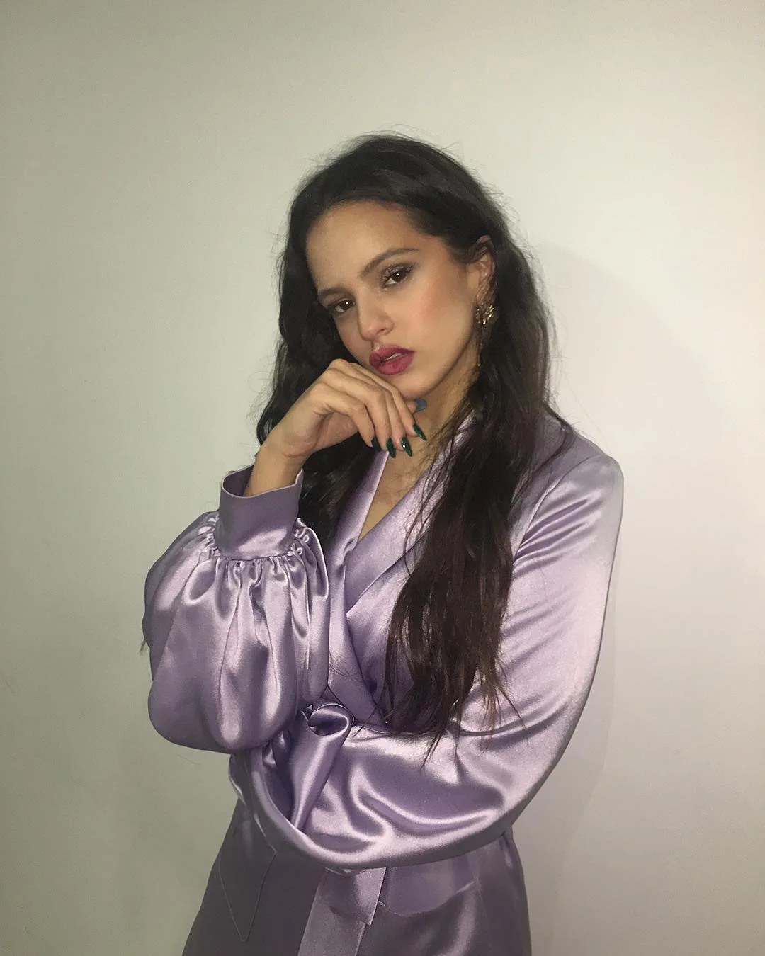 Rosalía’s Most Daring Beauty Looks, From Red Brows to Louis Vuitton Lips