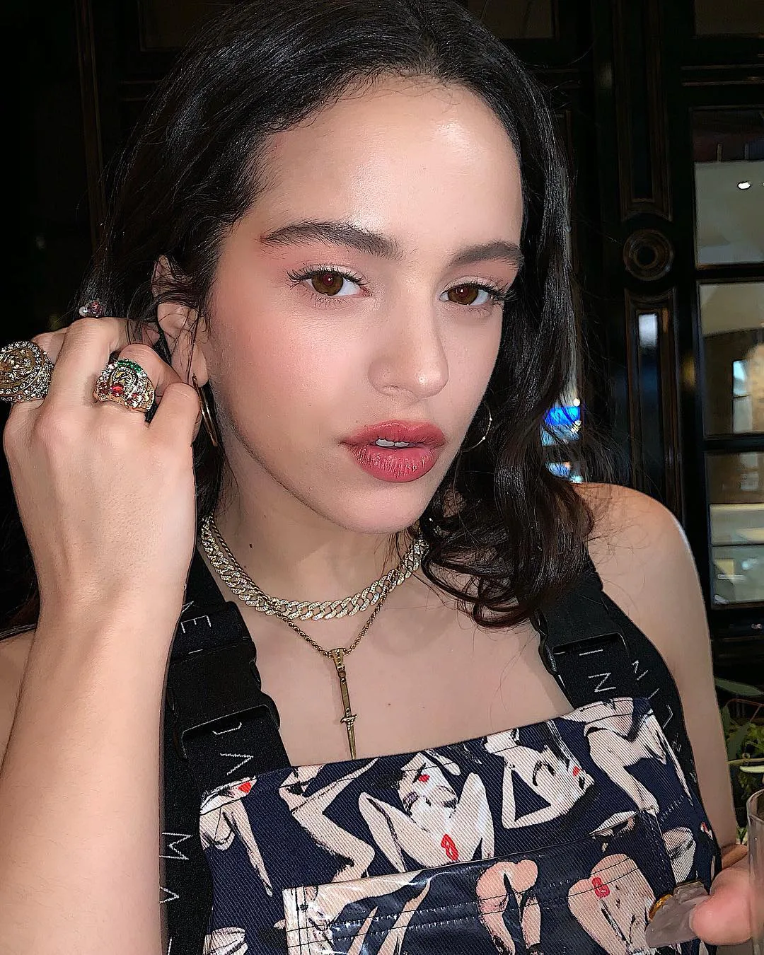 Rosalía’s Most Daring Beauty Looks, From Red Brows to Louis Vuitton Lips