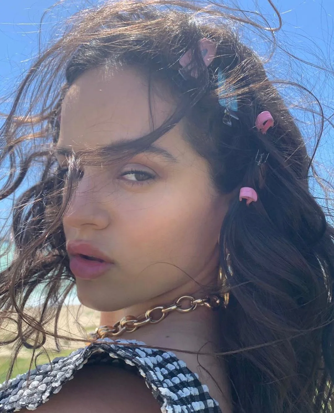Rosalía’s Most Daring Beauty Looks, From Red Brows to Louis Vuitton Lips