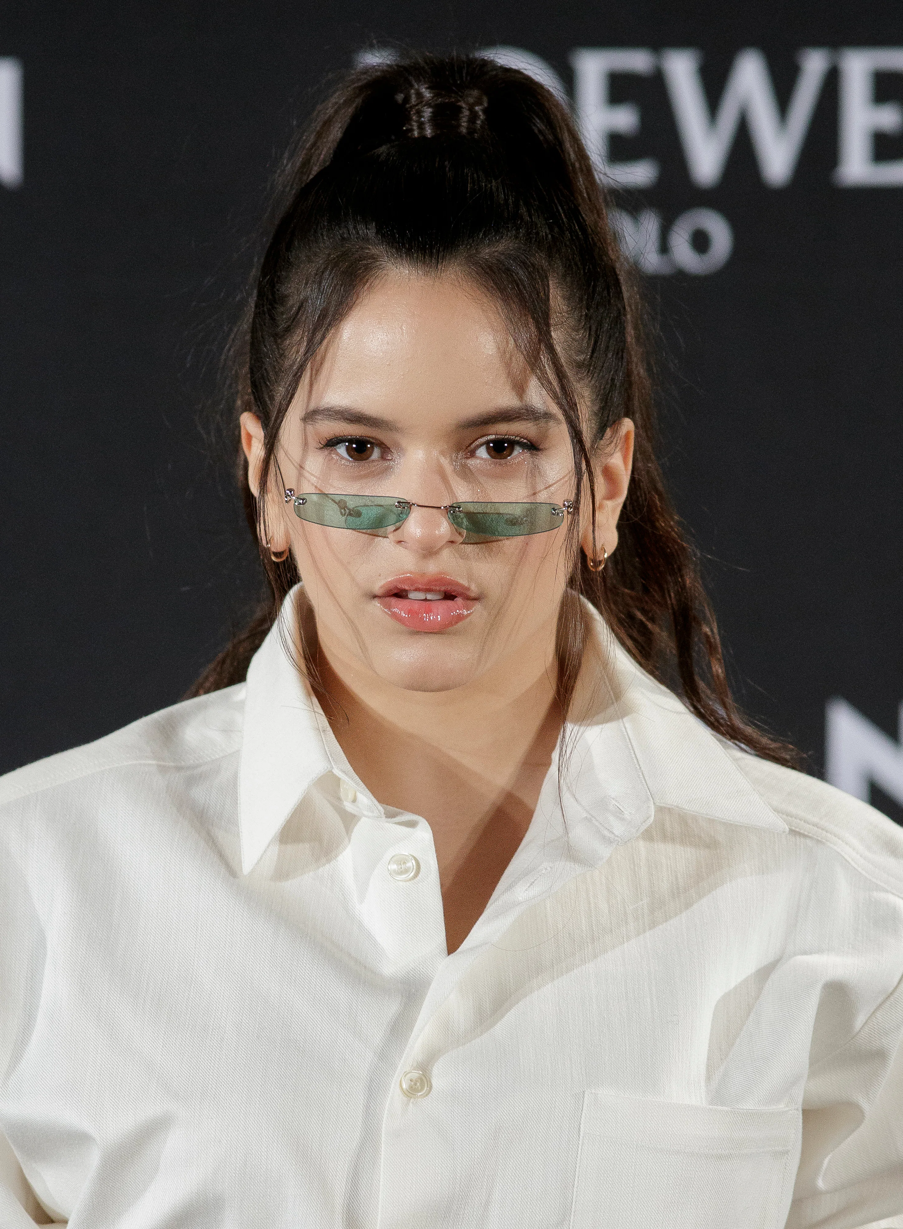 Rosalía’s Most Daring Beauty Looks, From Red Brows to Louis Vuitton Lips