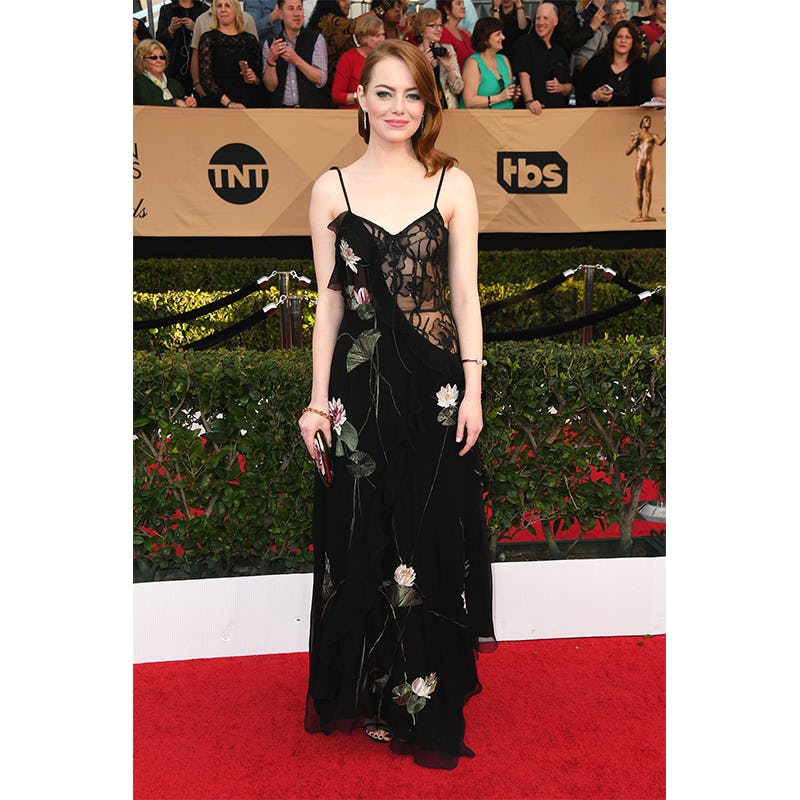 Emma Stone’s Sophisticated Dress Is An Unexpected Trend For Party Season