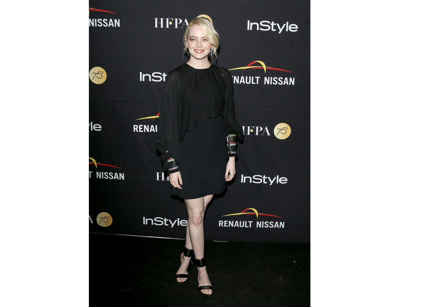 Emma Stone’s Sophisticated Dress Is An Unexpected Trend For Party Season